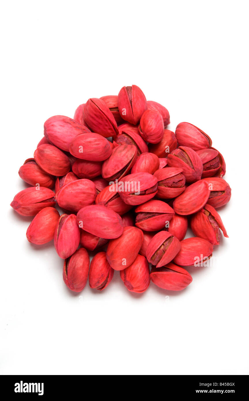 Red pistachio nuts on white Stock Photo - Alamy