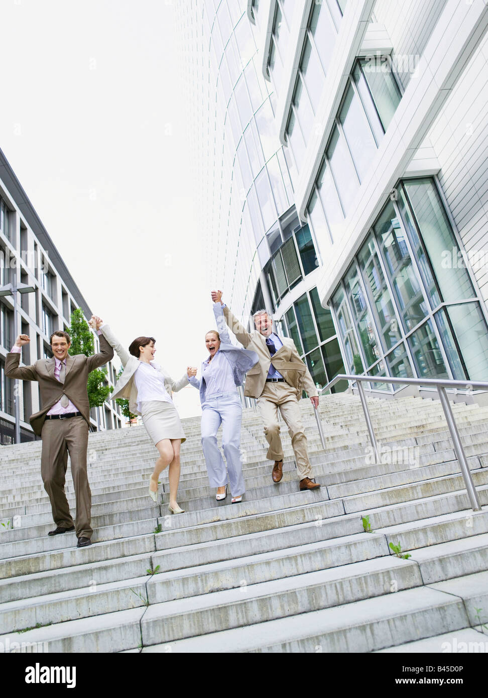 Germany, Baden-Württemberg, Stuttgart, Businesspeople cheering Stock ...