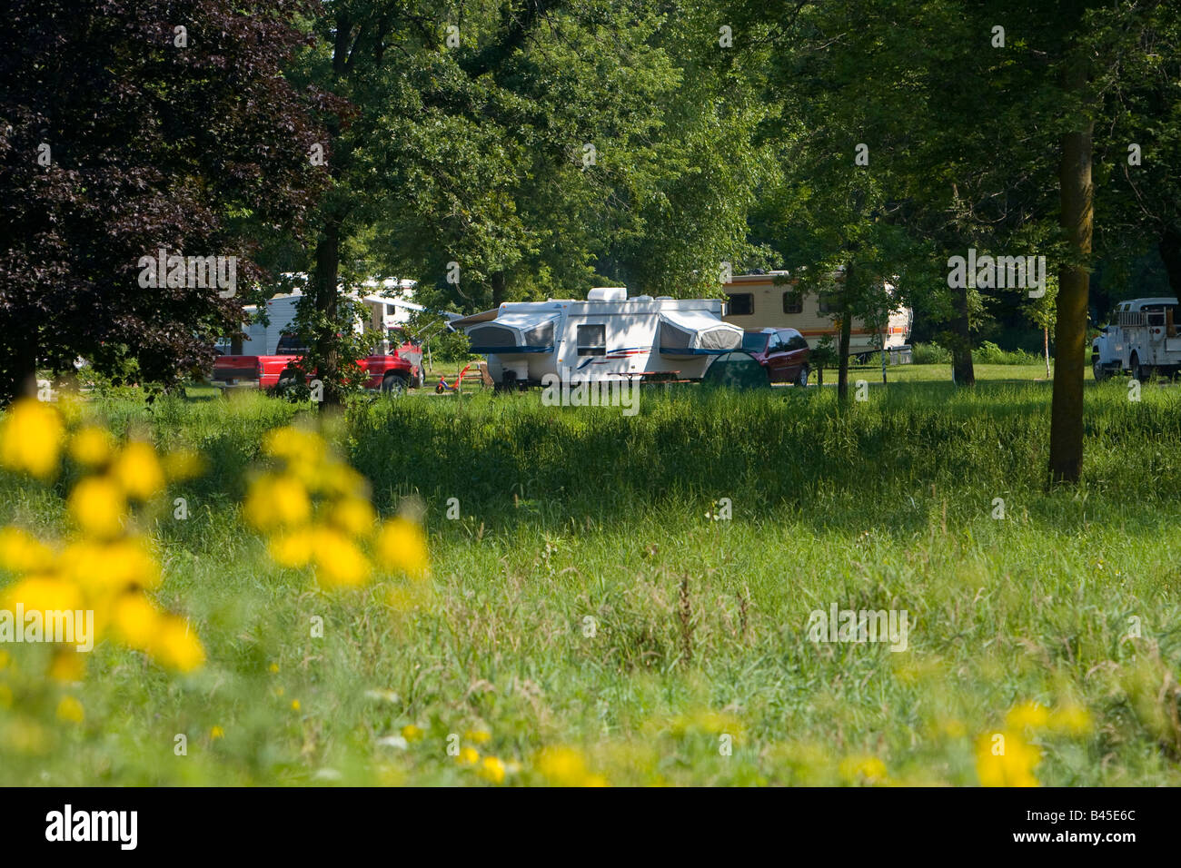 View through field of campground Stock Photo - Alamy
