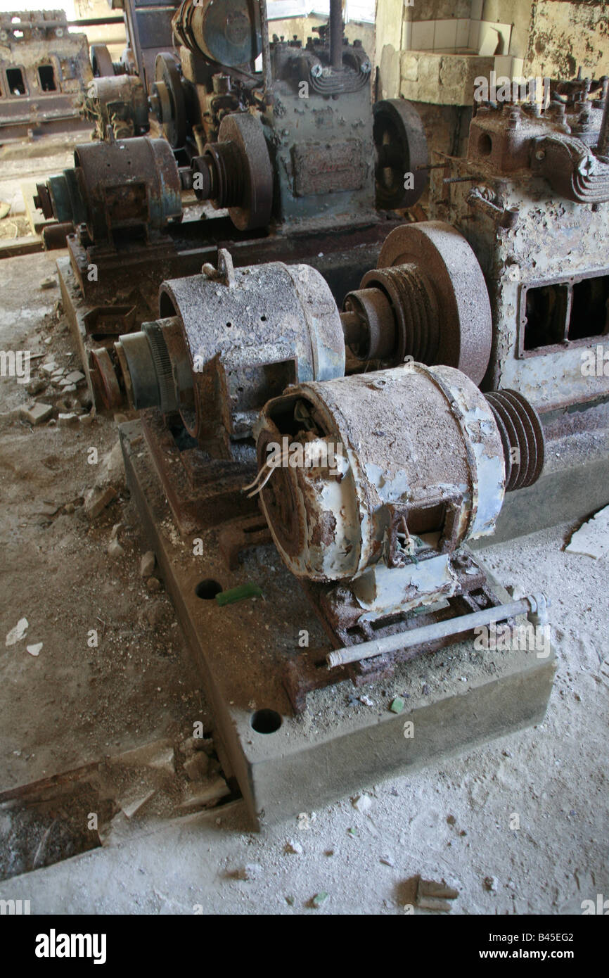 old damaged machinery in derelict manufacturing workshop Stock Photo ...