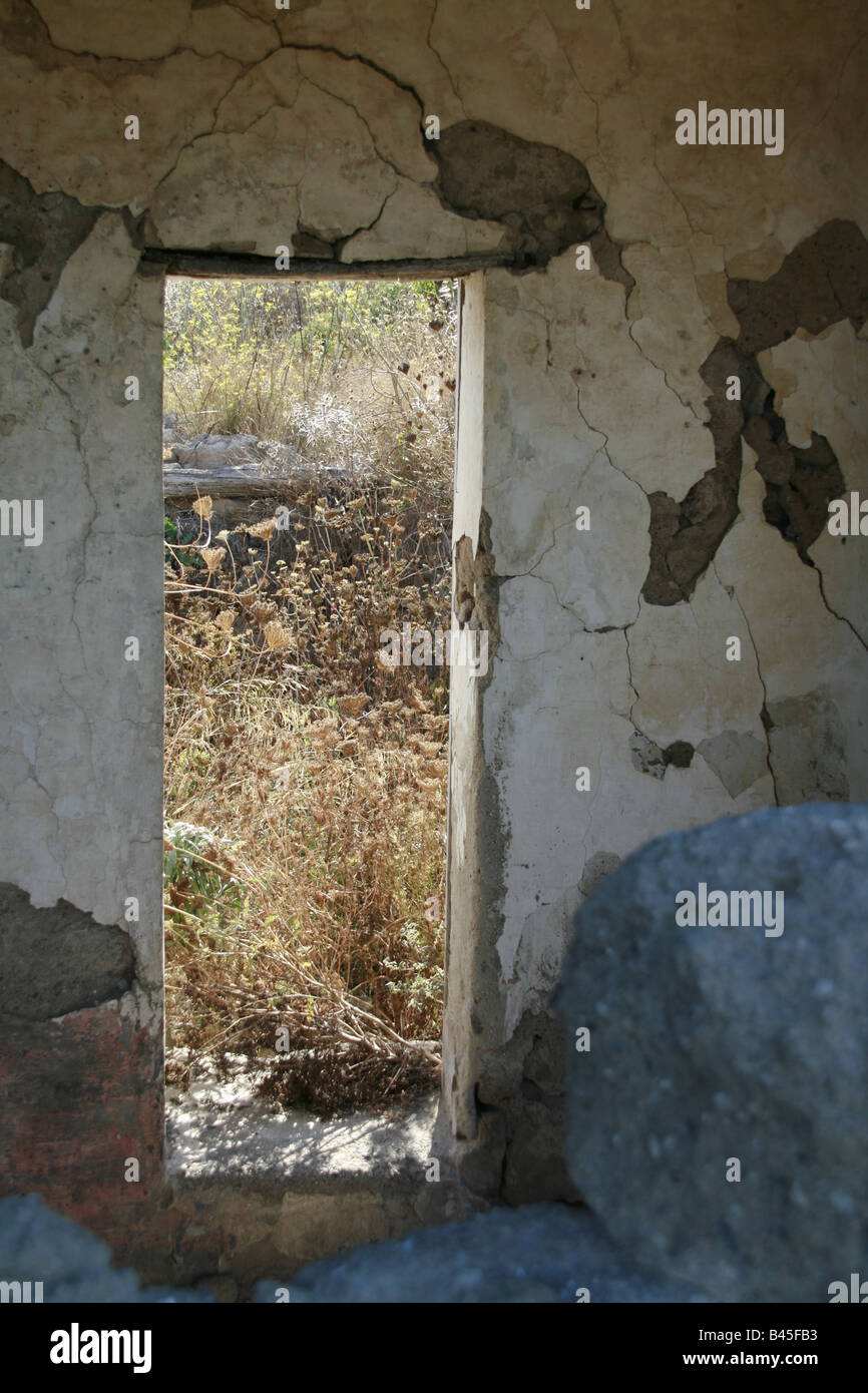 one damaged missing open door way in derelict property Stock Photo - Alamy