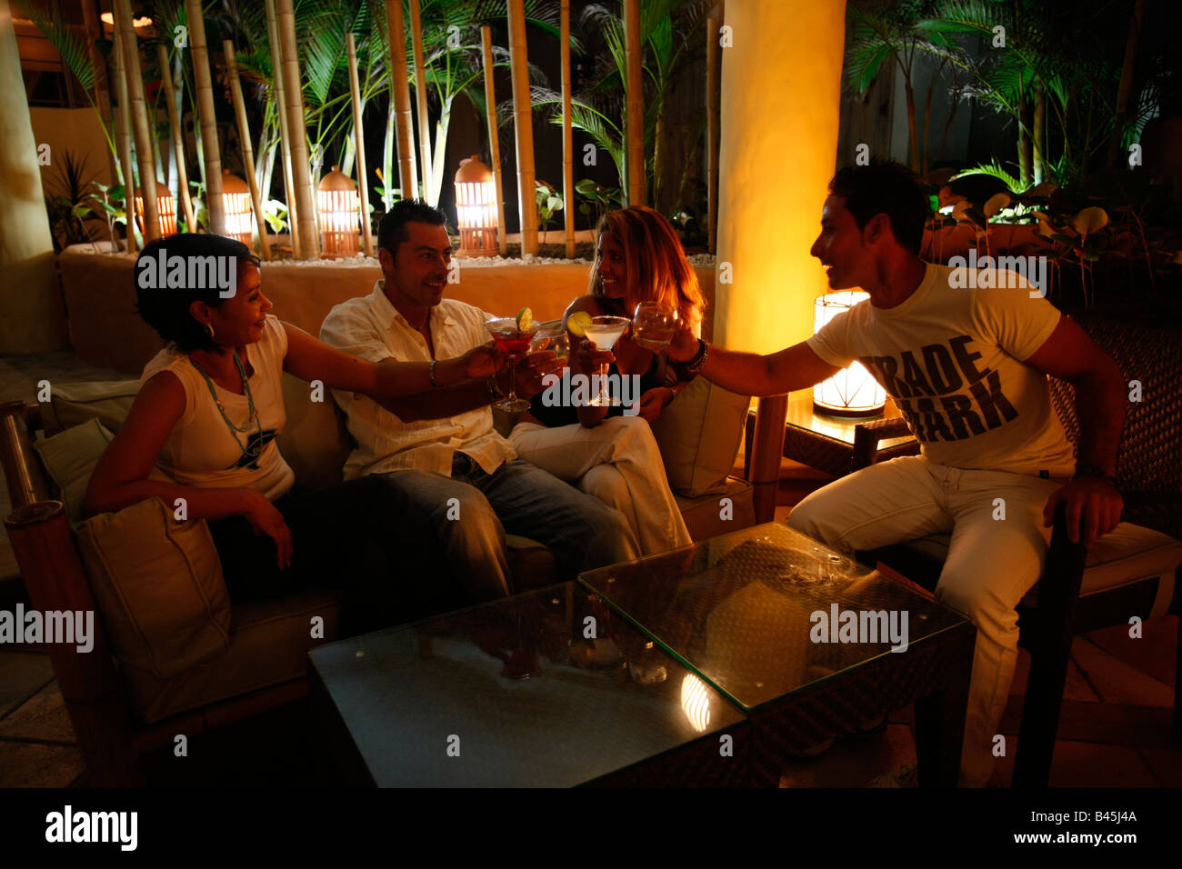 couples socializing at a bar Stock Photo - Alamy