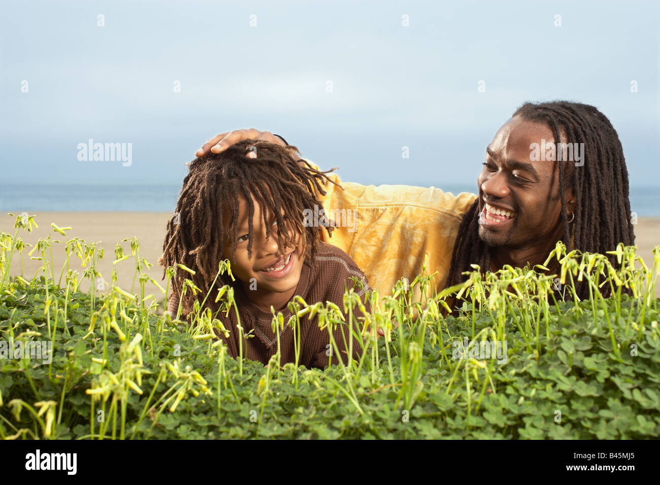 Parent patting child head hi-res stock photography and images - Alamy