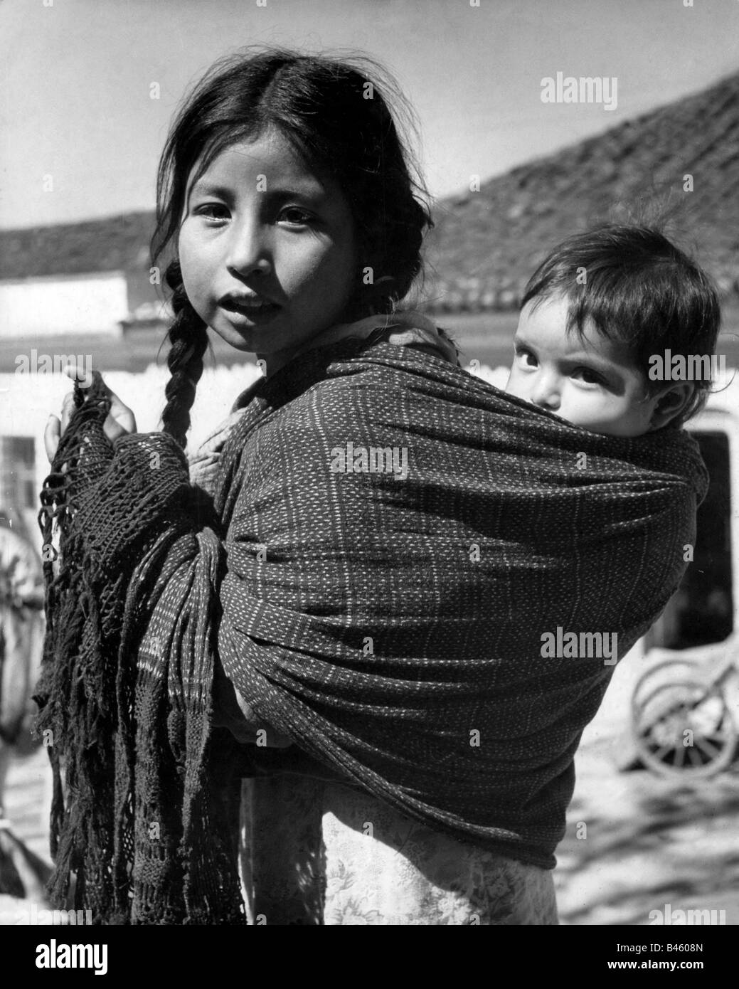 people, children, girl is carrying an infant on back, Janitzio, Mexico ...
