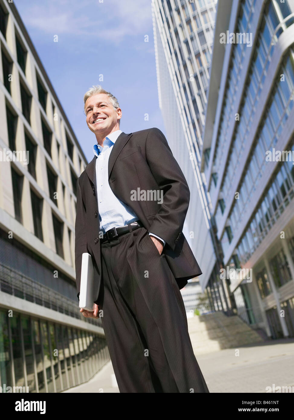 Germany, Baden-Württemberg, Stuttgart, Businessman with hand in pocket ...