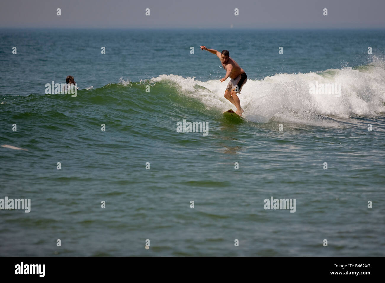 Surfing waves of Far Rockaway Beach on a very hot day of June Far ...