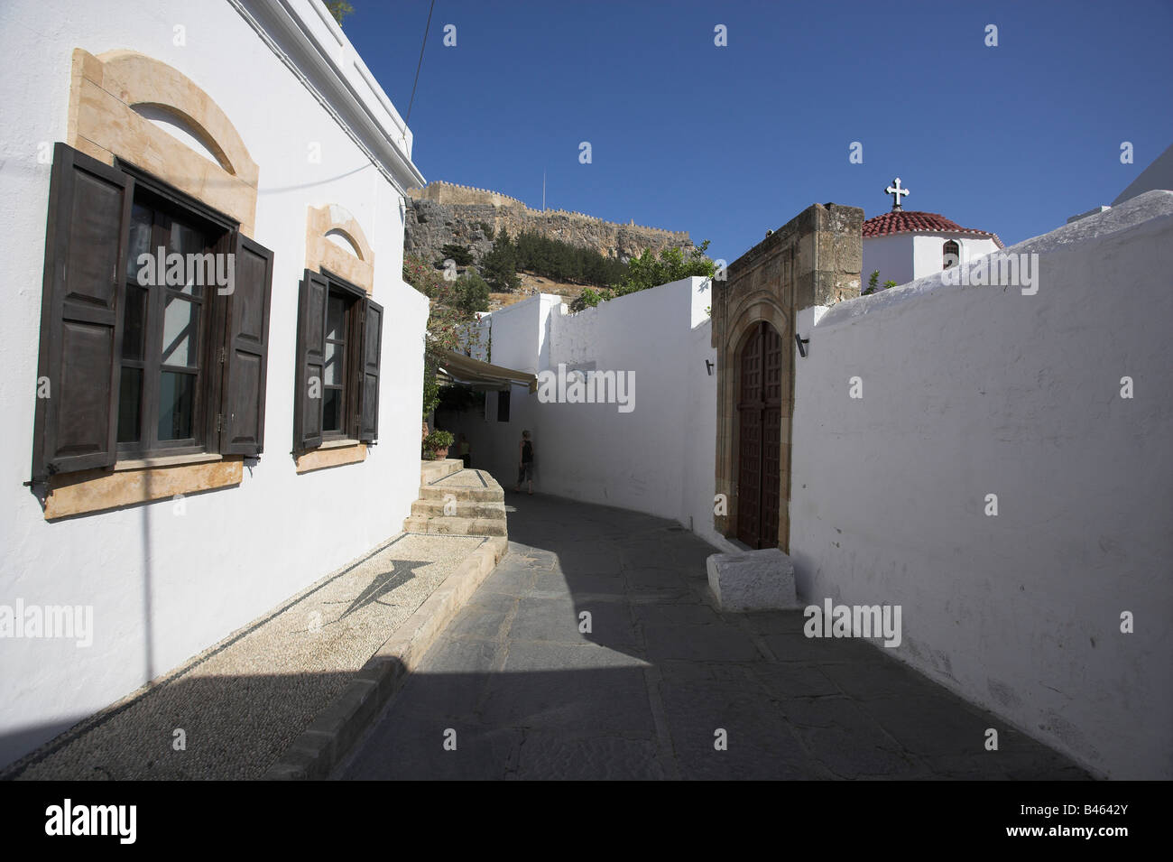 Above the modern town rises the acropolis of lindos hi-res stock ...