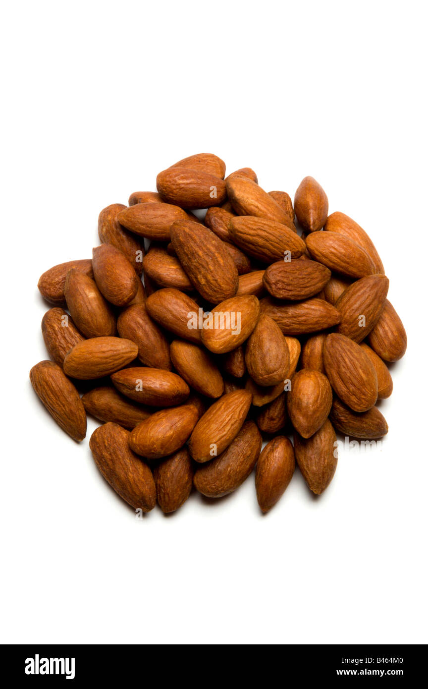 Pile of almonds on white Stock Photo - Alamy
