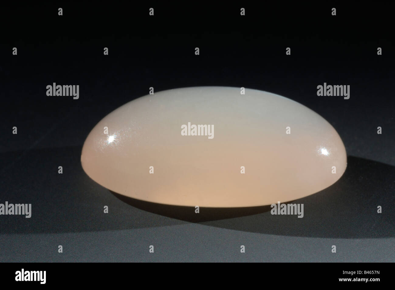 Moonstone, polished pebble, studio picture Stock Photo - Alamy