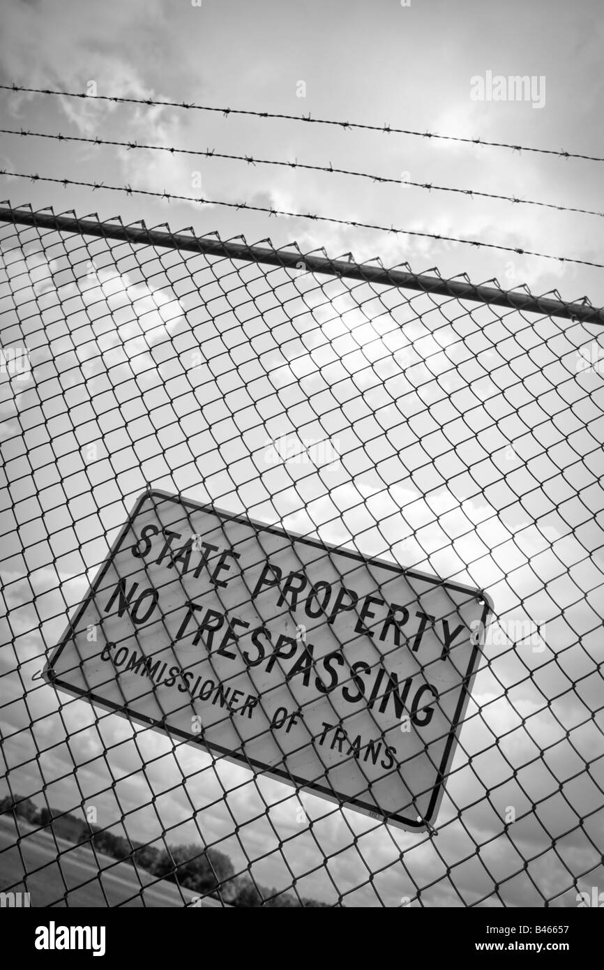 No trespass warning sign fence Black and White Stock Photos & Images ...