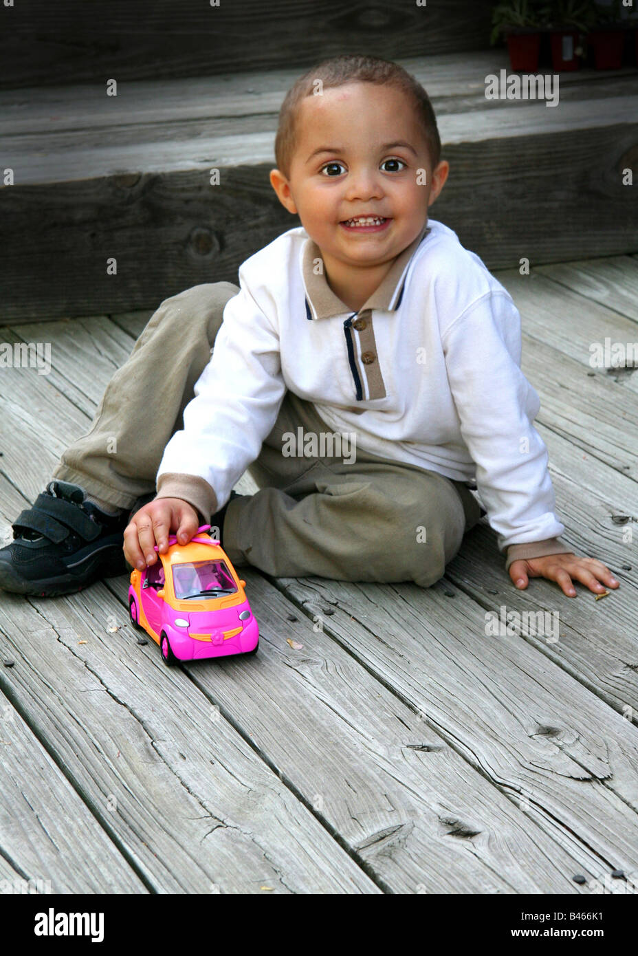 Young toddler boy playing with car Stock Photo - Alamy