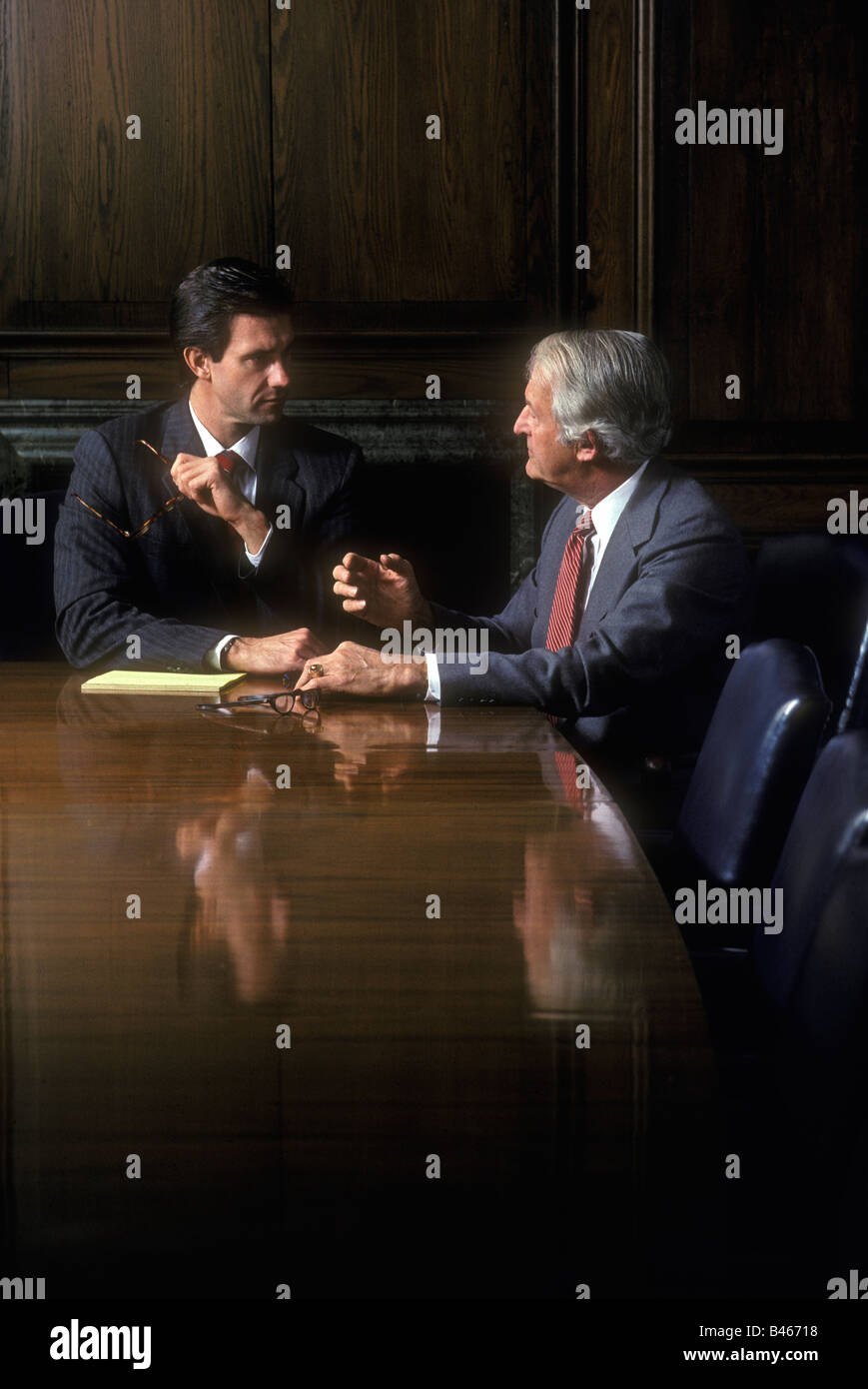Two executives in a boardroom meeting Stock Photo - Alamy