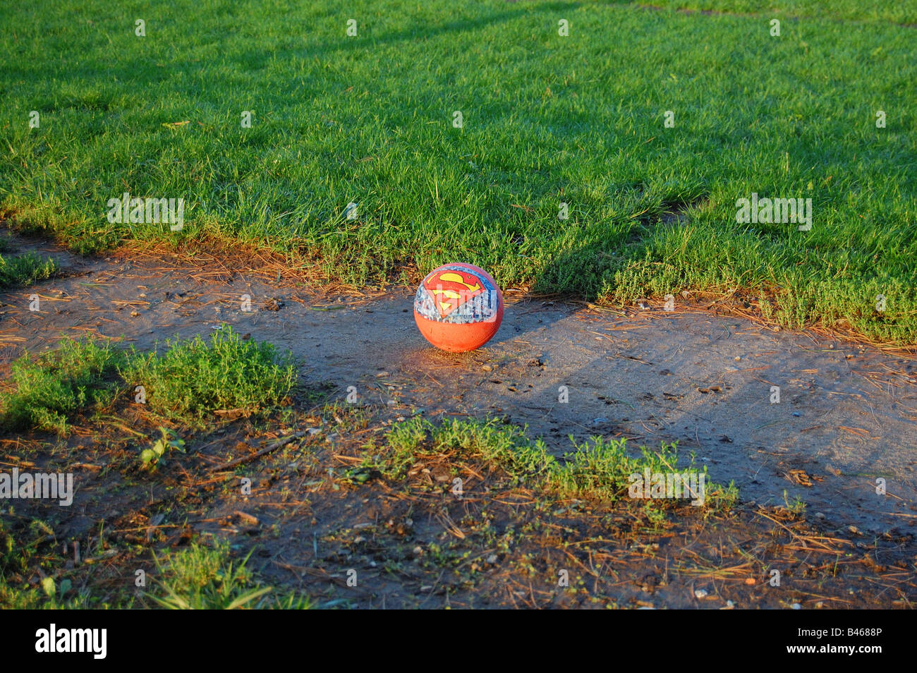 Ball alone on a playground on an autumn evening Stock Photo - Alamy
