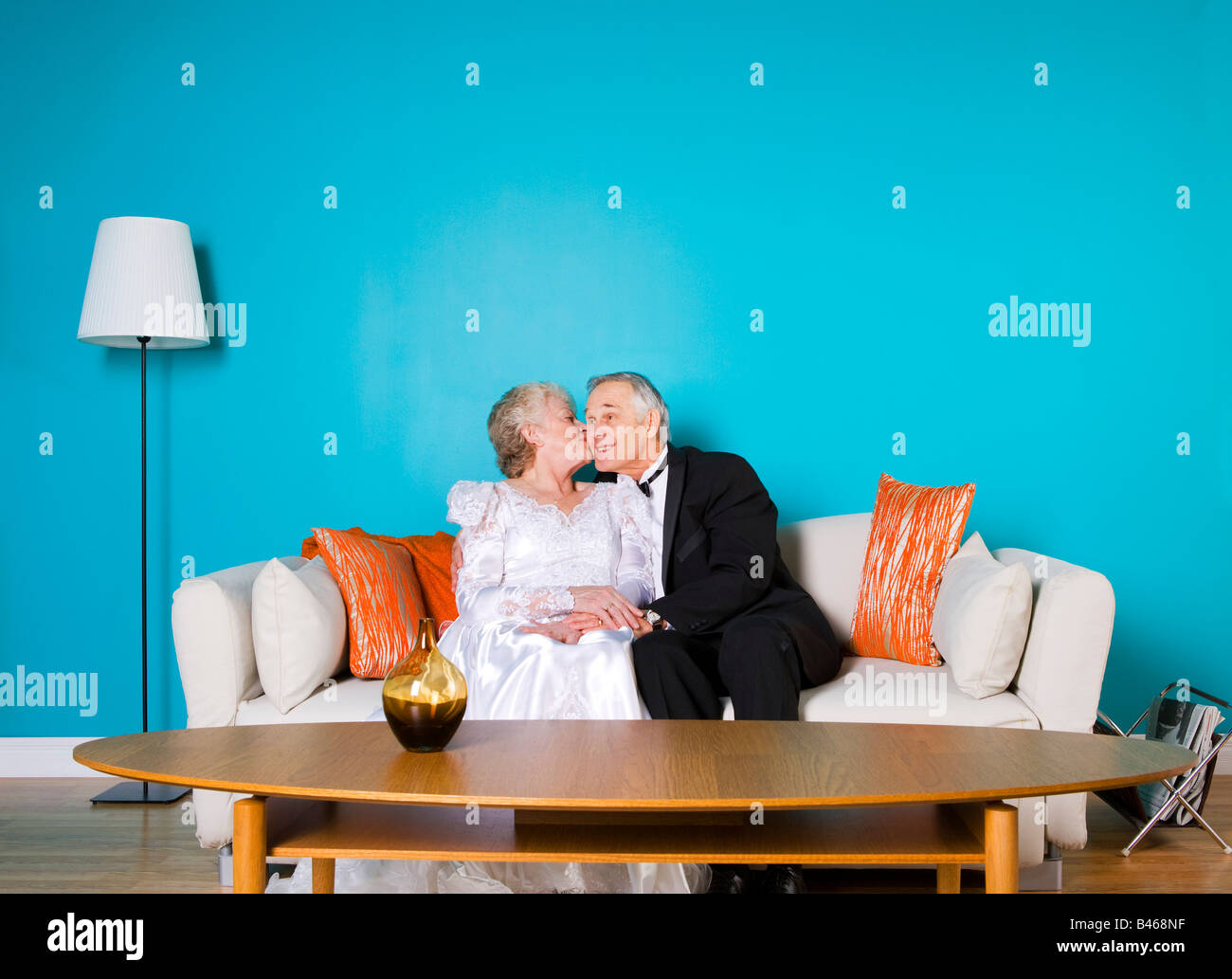 Senior bride and groom in living room Stock Photo - Alamy