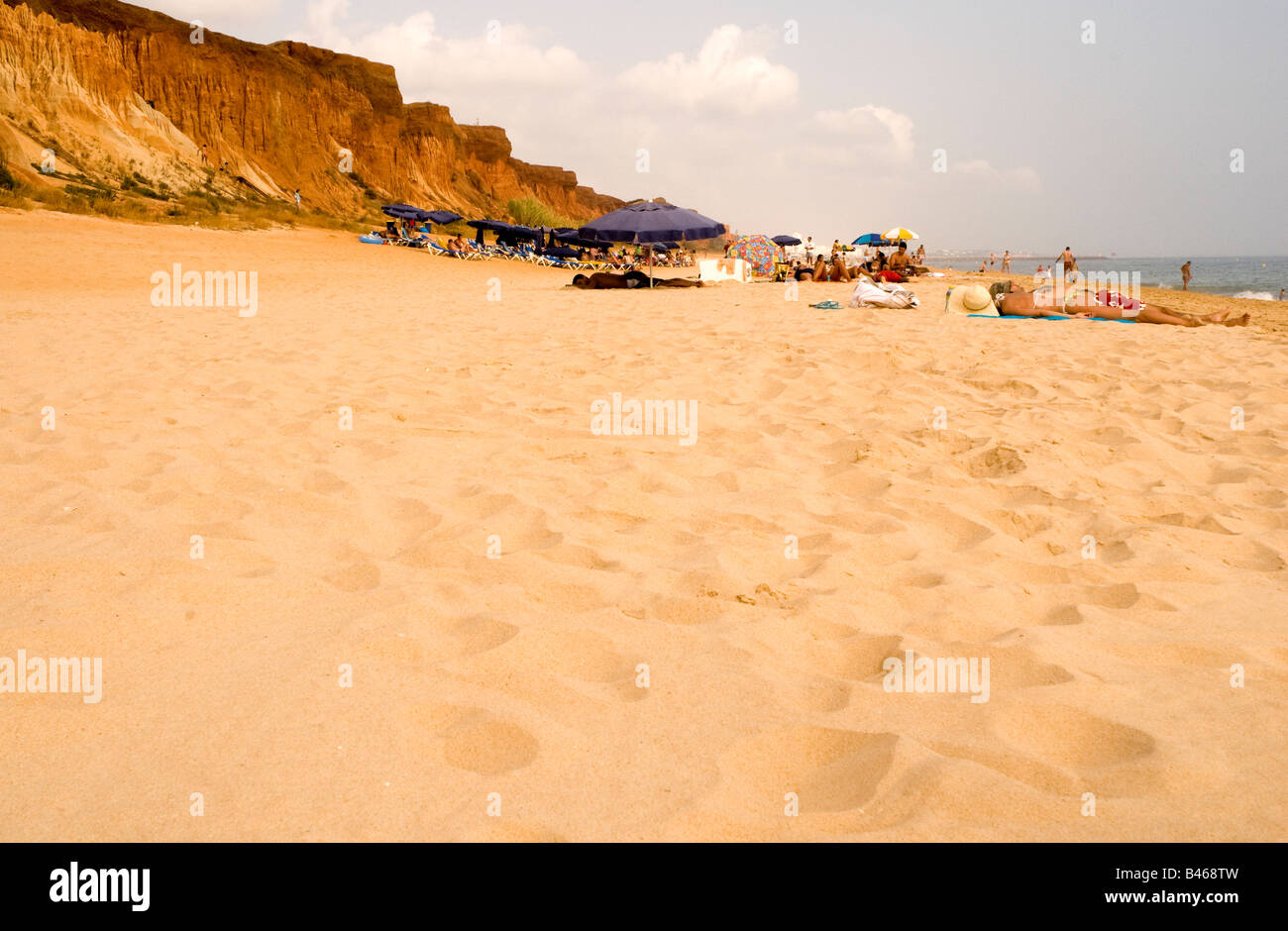 Man and a woman relaxing on the beach hi-res stock photography and ...