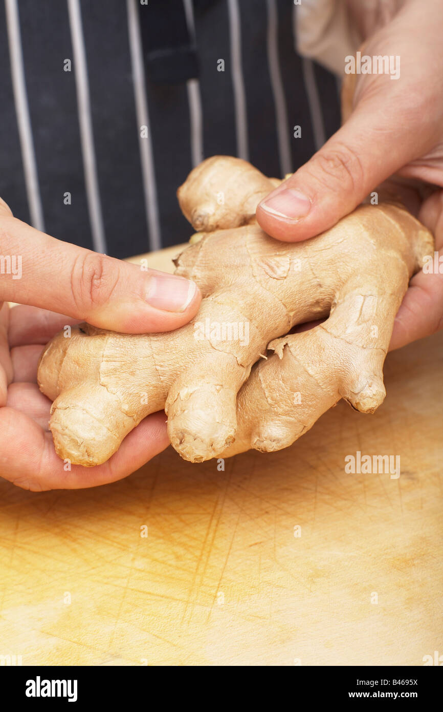 Person holding ginger root, close-up Stock Photo - Alamy