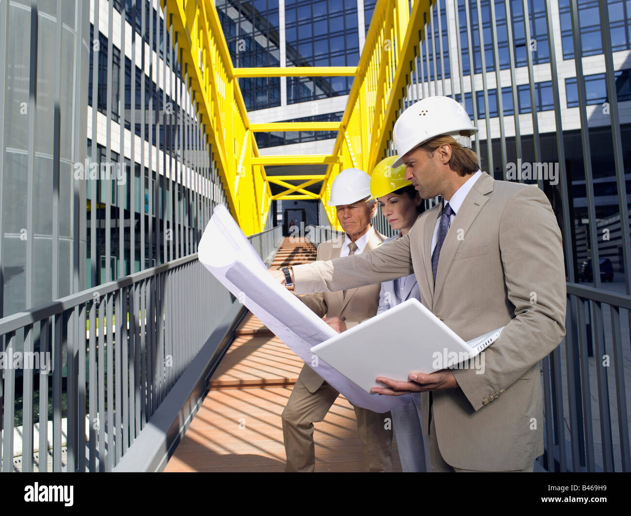 Engineer looking at bridge and plans hi-res stock photography and ...