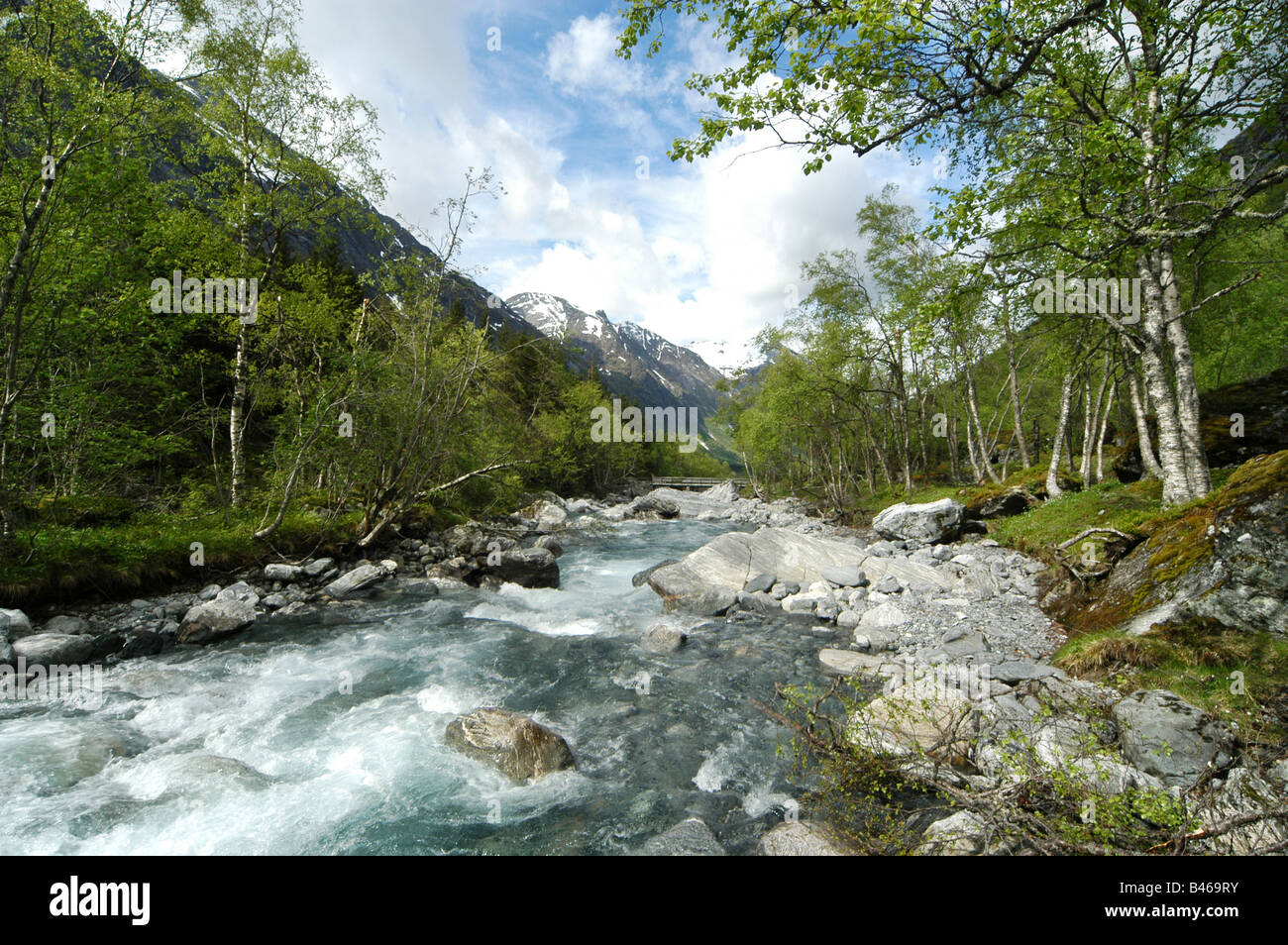 Beautiful view of glacial melt water flowing in a torrent from the ...