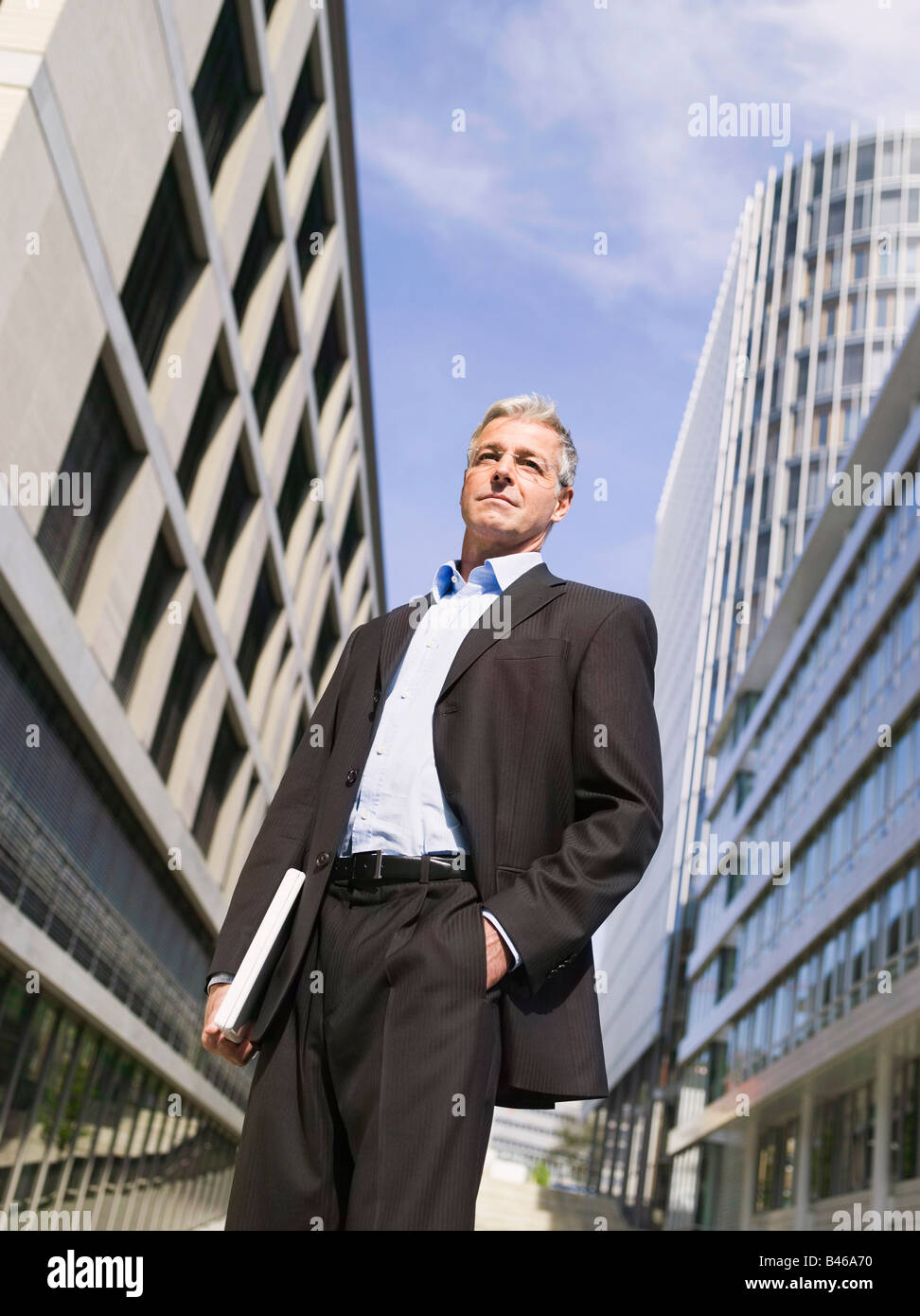 Germany, Baden-Württemberg, Stuttgart, Businessman with hand in pocket ...