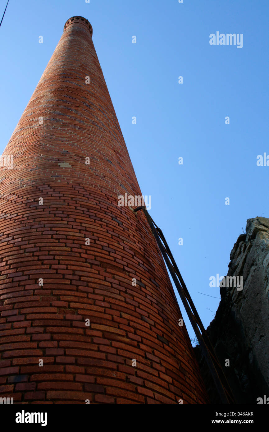 tall industrial curved brick chimney Cennes-Monesties Stock Photo - Alamy