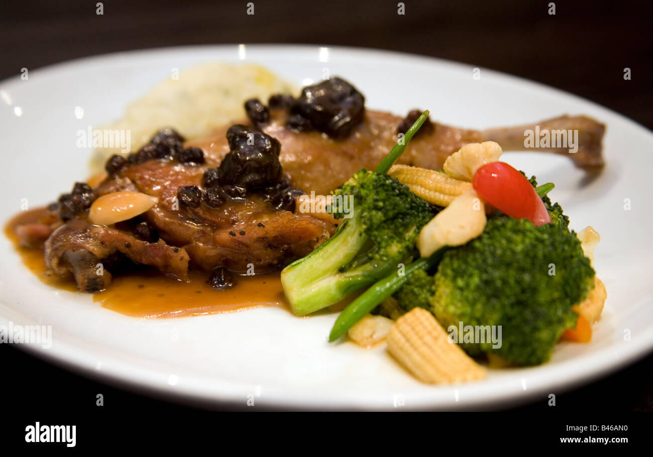 Honey glazed roasted duck leg with dried fruit Stock Photo - Alamy