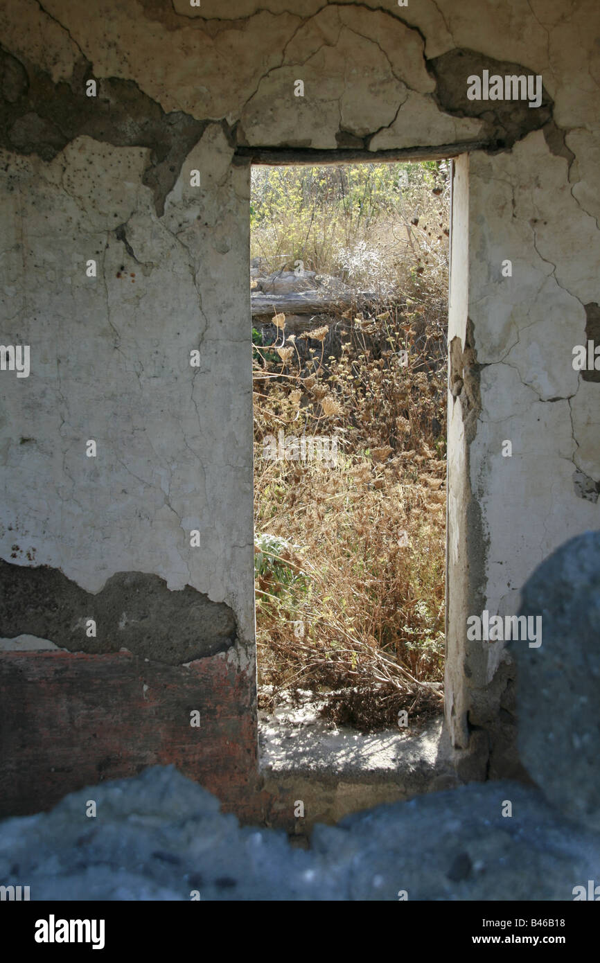 one damaged missing open door way in derelict property Stock Photo - Alamy