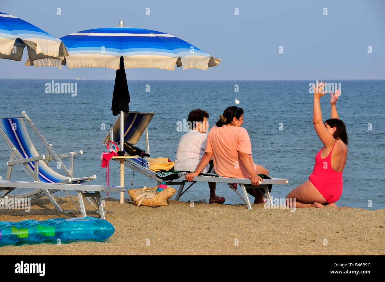 ladies on the beach Stock Photo - Alamy