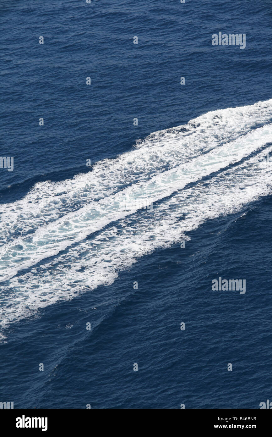 outboard motor speed boat trail in action in blue sea Stock Photo - Alamy