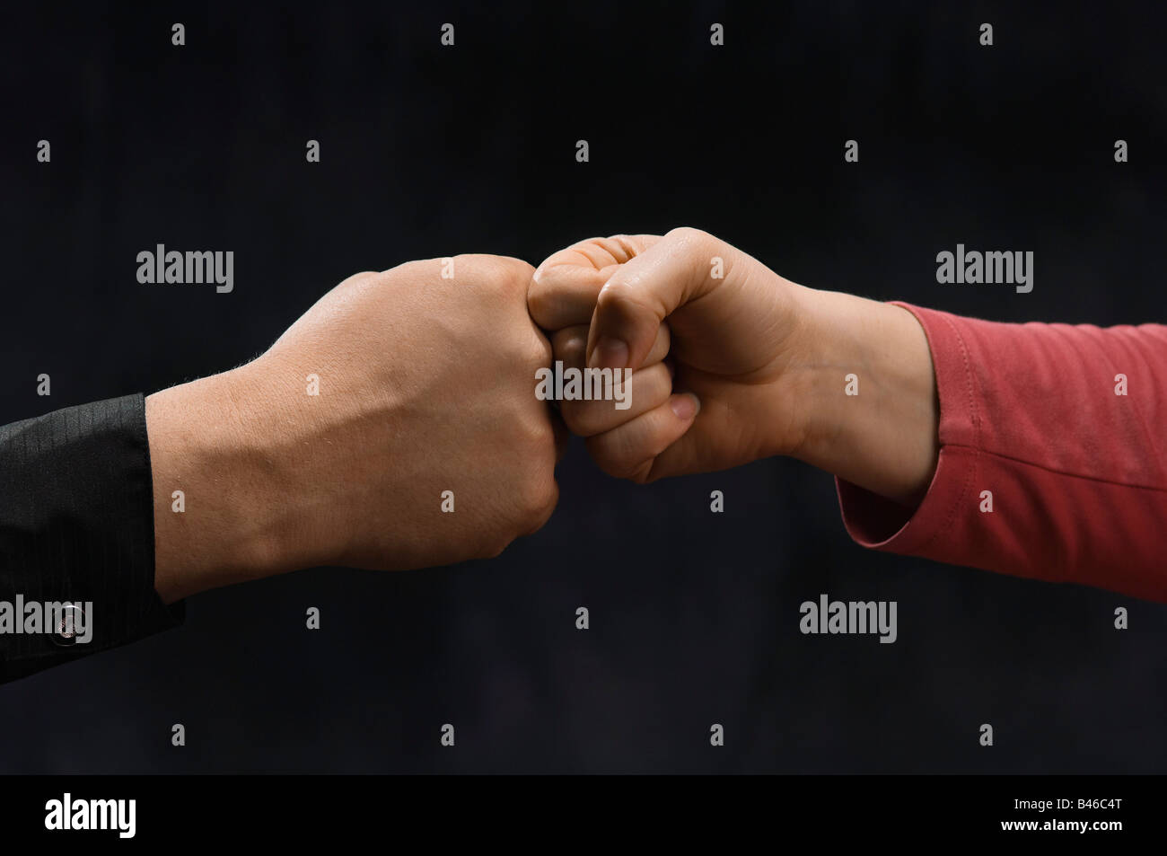 Two fists together hi-res stock photography and images - Alamy