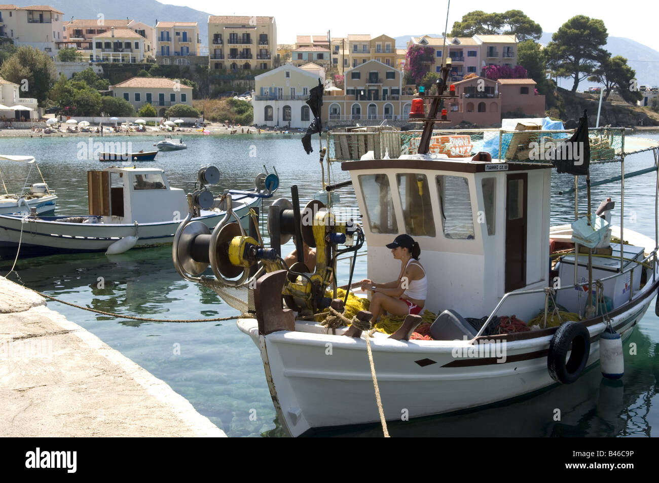 Fishing boat in Assos harbour Stock Photo - Alamy