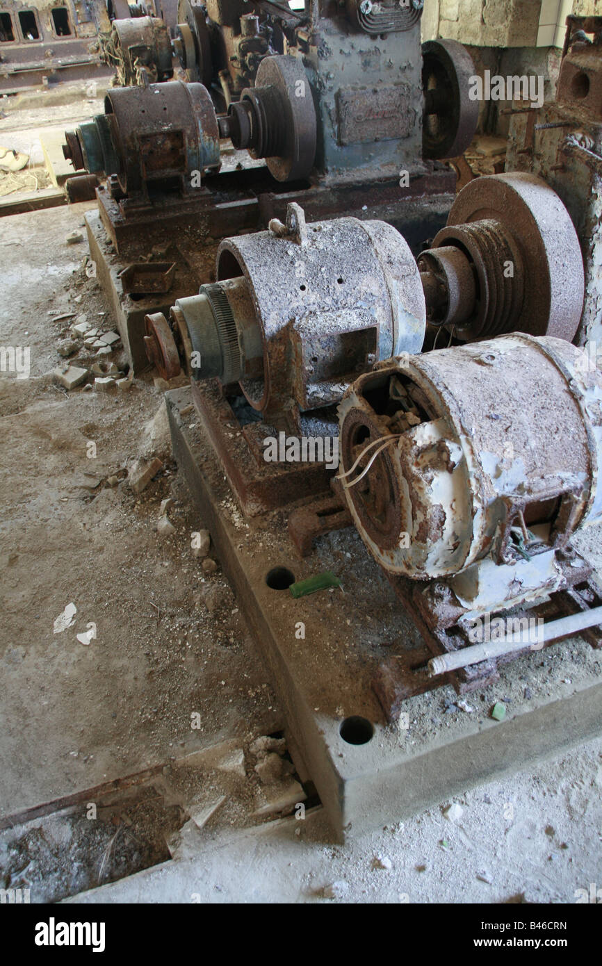 old damaged machinery in derelict manufacturing workshop Stock Photo ...