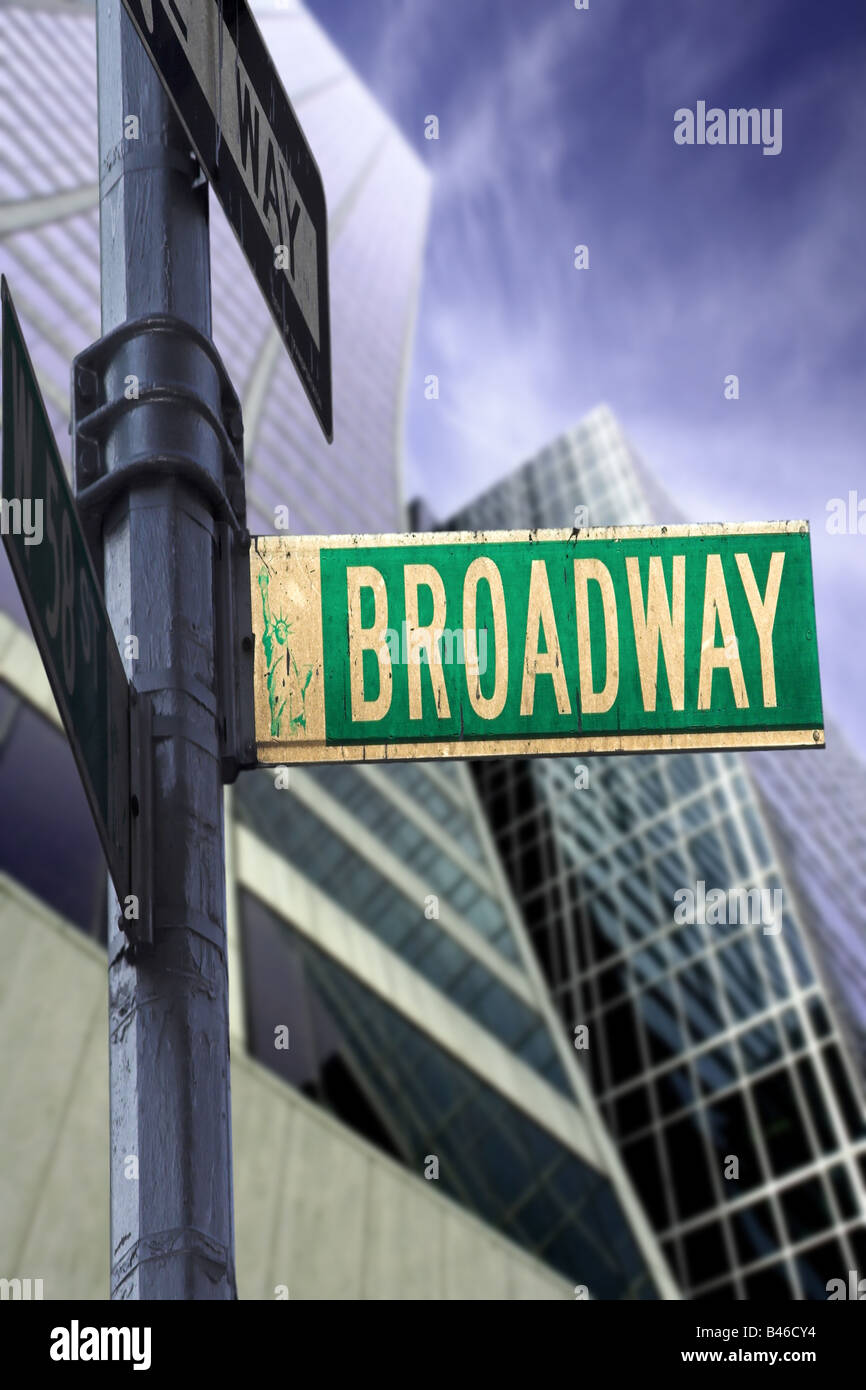 Broadway sign in front of a skyscraper with a dramatic blue sky Stock ...