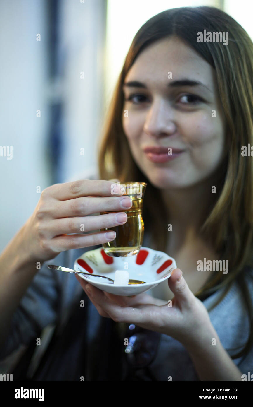 drinking apple flavoured tea in the Souks istanbul Stock Photo - Alamy