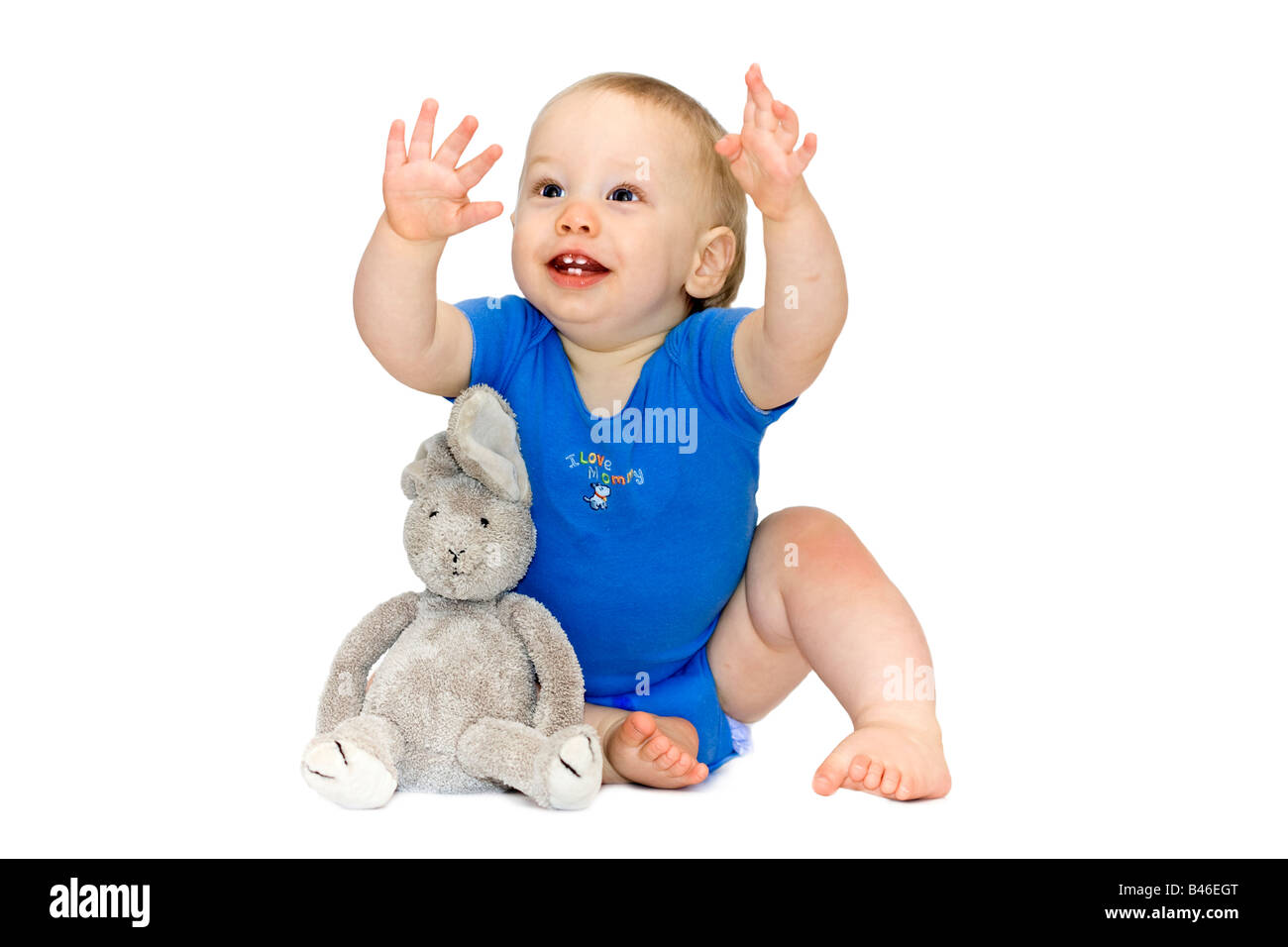 Cute baby boy holding a toy bunny Stock Photo - Alamy