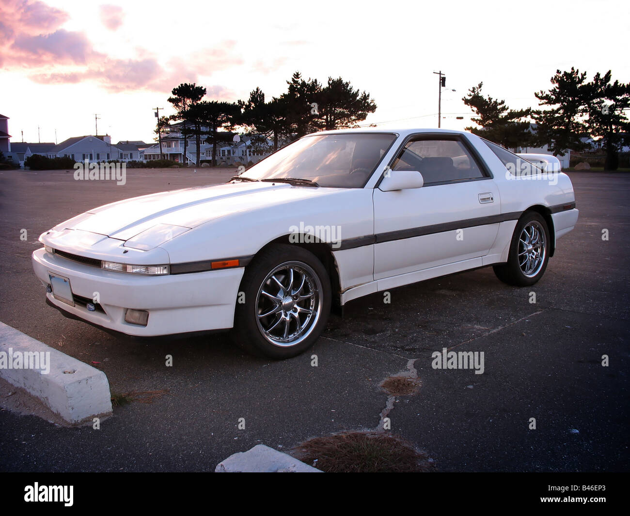 A customized white sports car parked at the beach Stock Photo - Alamy