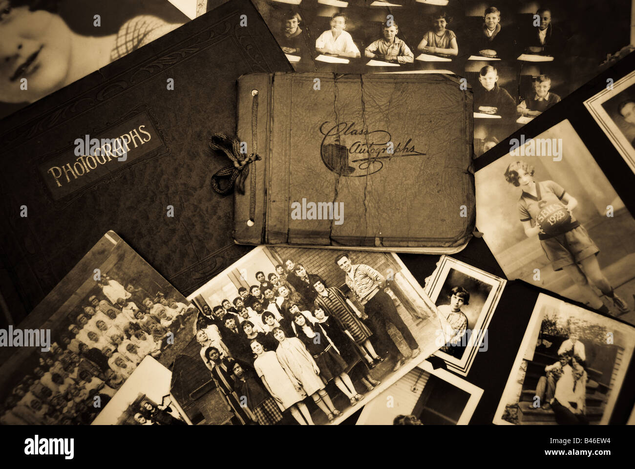 A collection of vintage class photos with an antique photo album and ...
