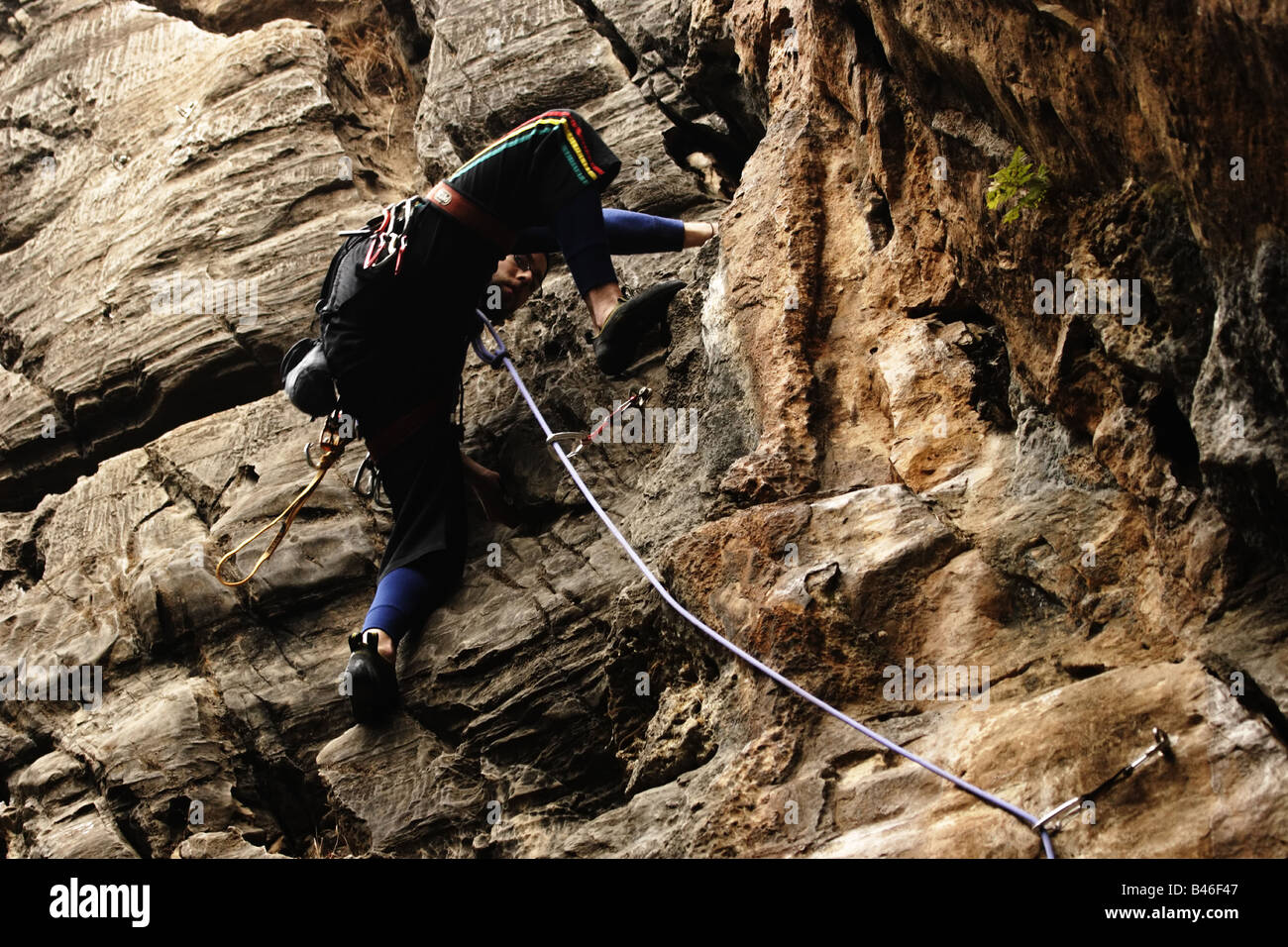 Man scaling climbing wall hi-res stock photography and images - Alamy