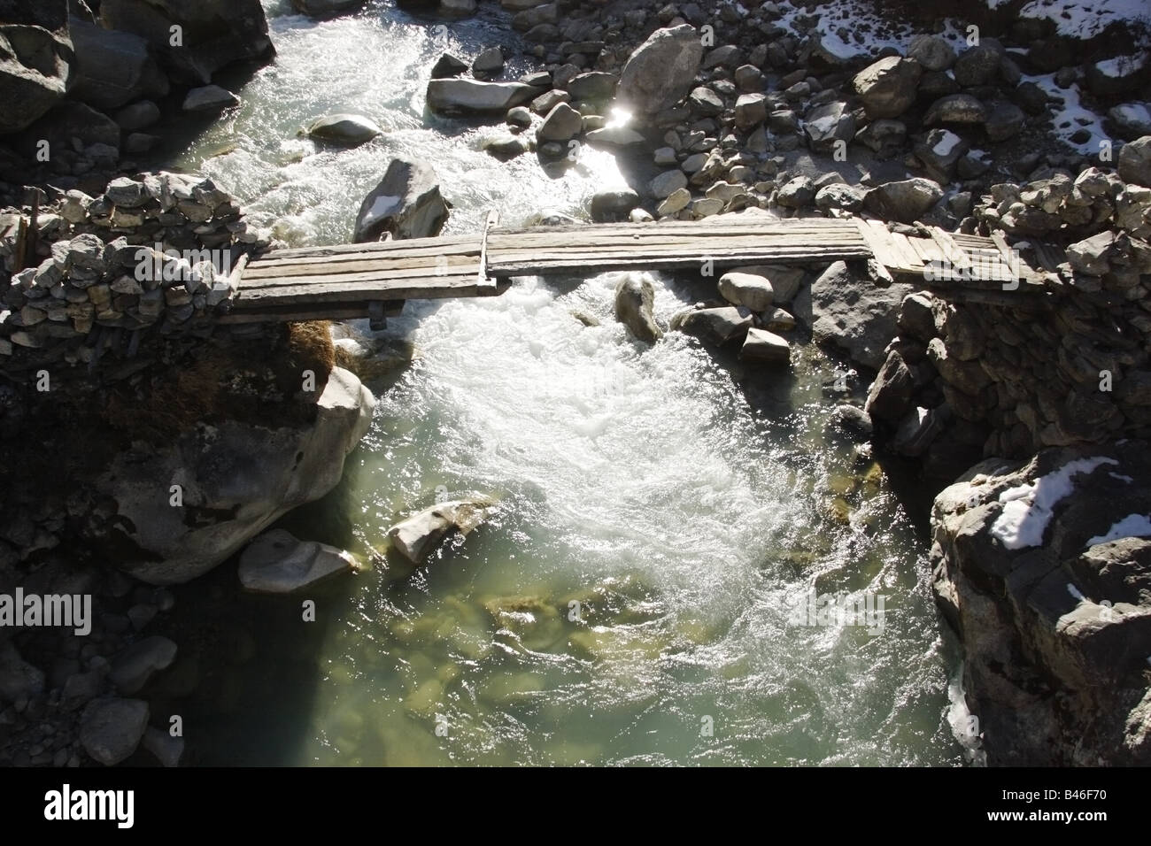 Old Tibetan cantilever bridge crossing the Langtang river in Upper ...