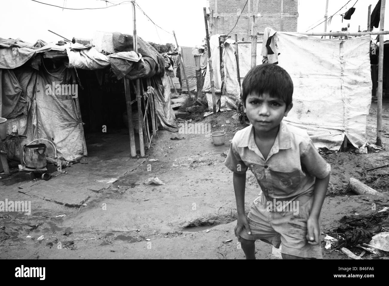 Environmental portrait of a boy in a slum squatter village in Kathmandu ...