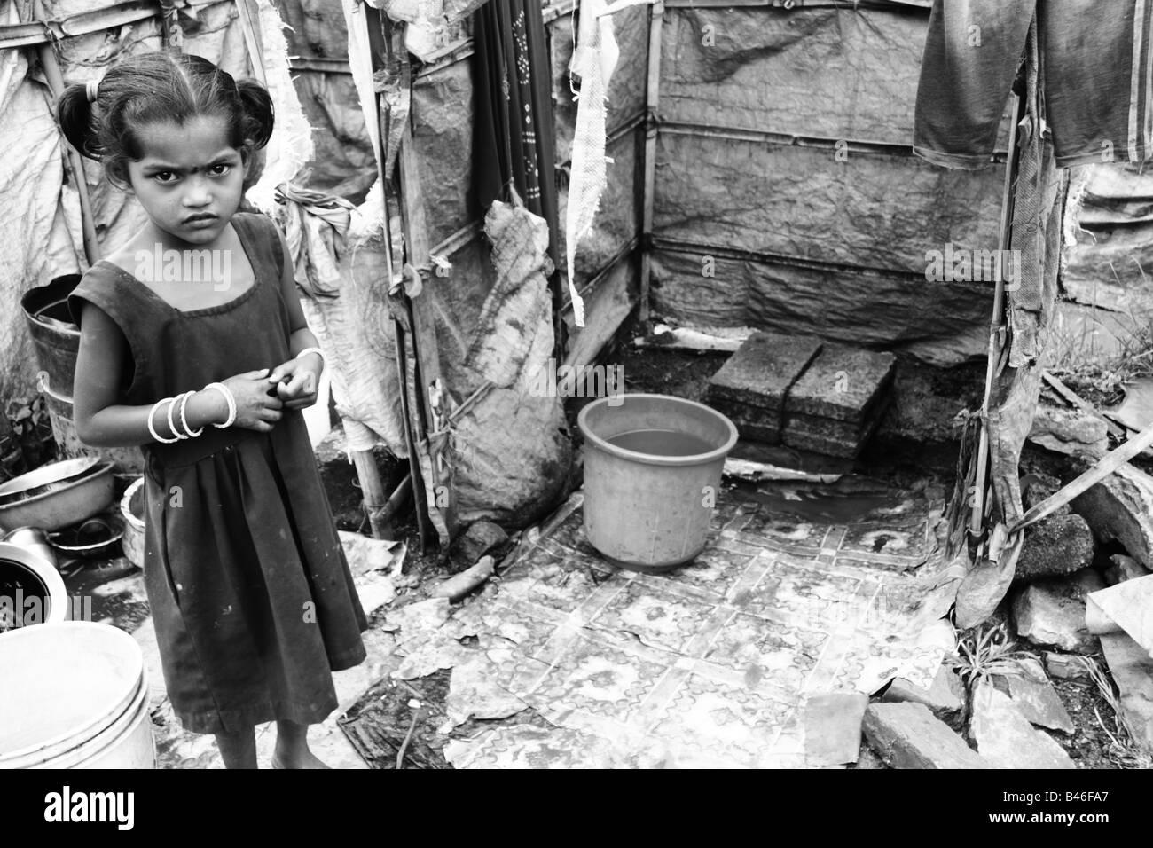 Environmental portrait of a girl in a slum squatter village in ...