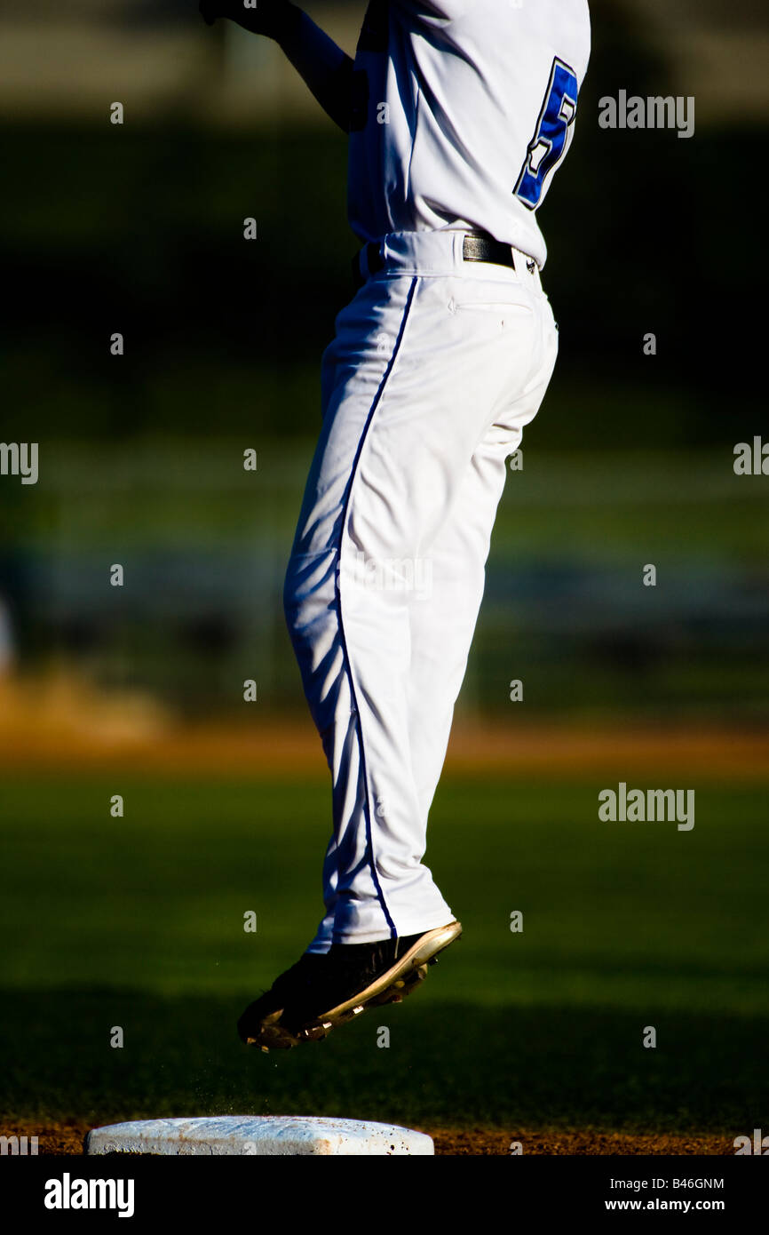 Baseball player jumping Stock Photo - Alamy