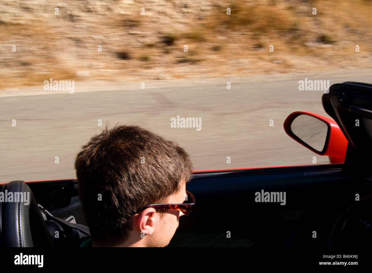 View of a young man driving a car Stock Photo - Alamy