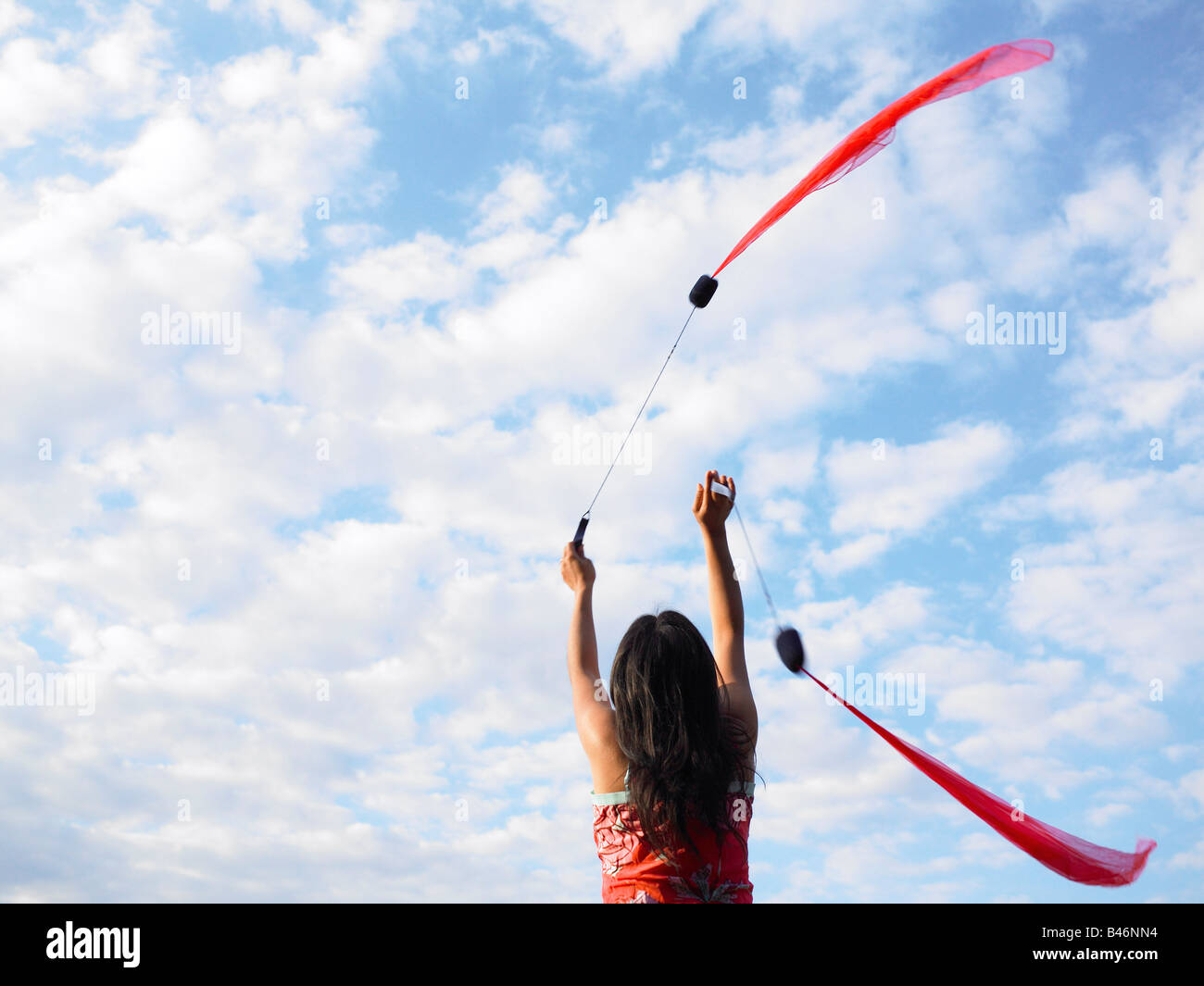 Woman Twirling Poi Stock Photo - Alamy