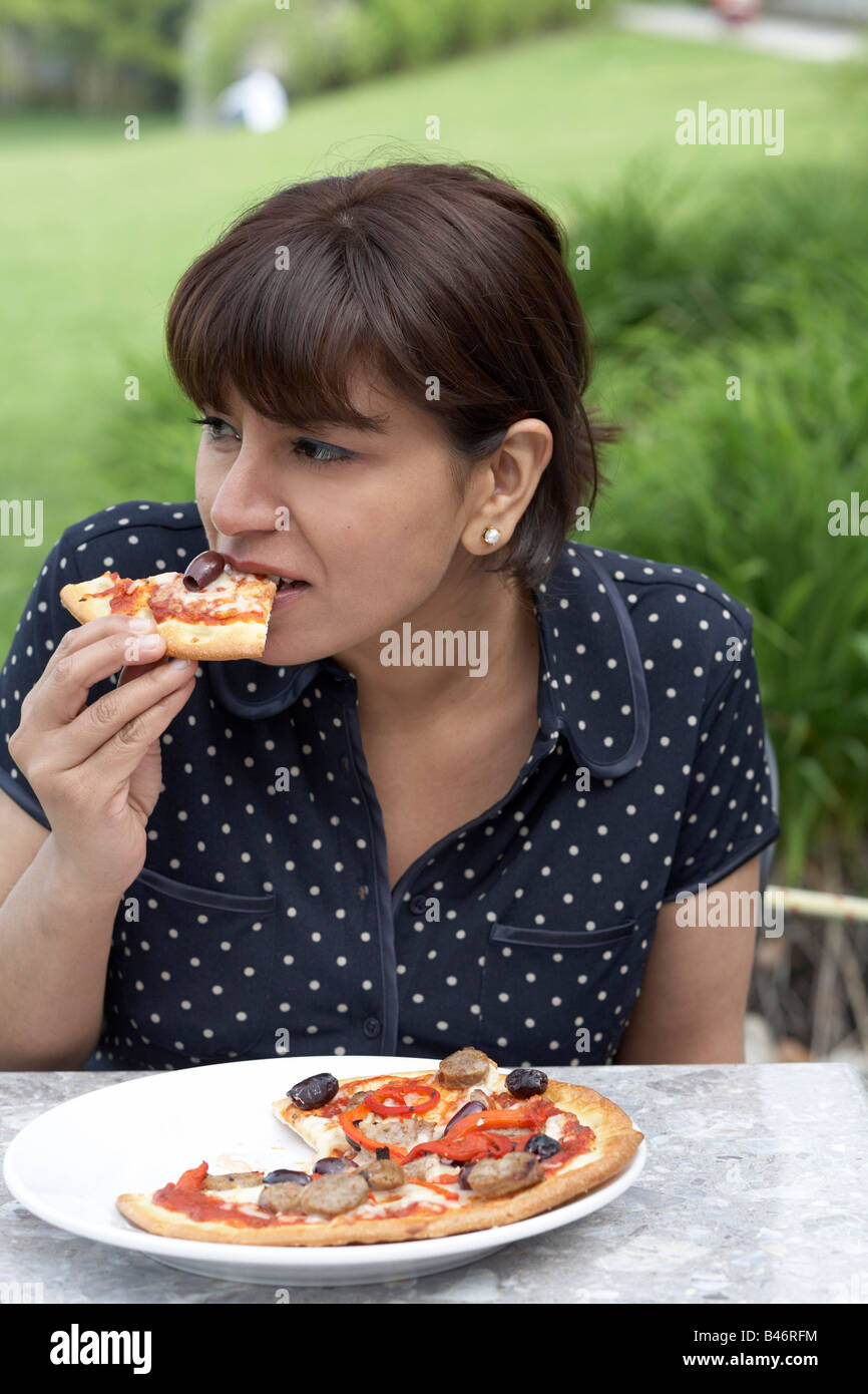 Woman Eating Pizza Stock Photo - Alamy