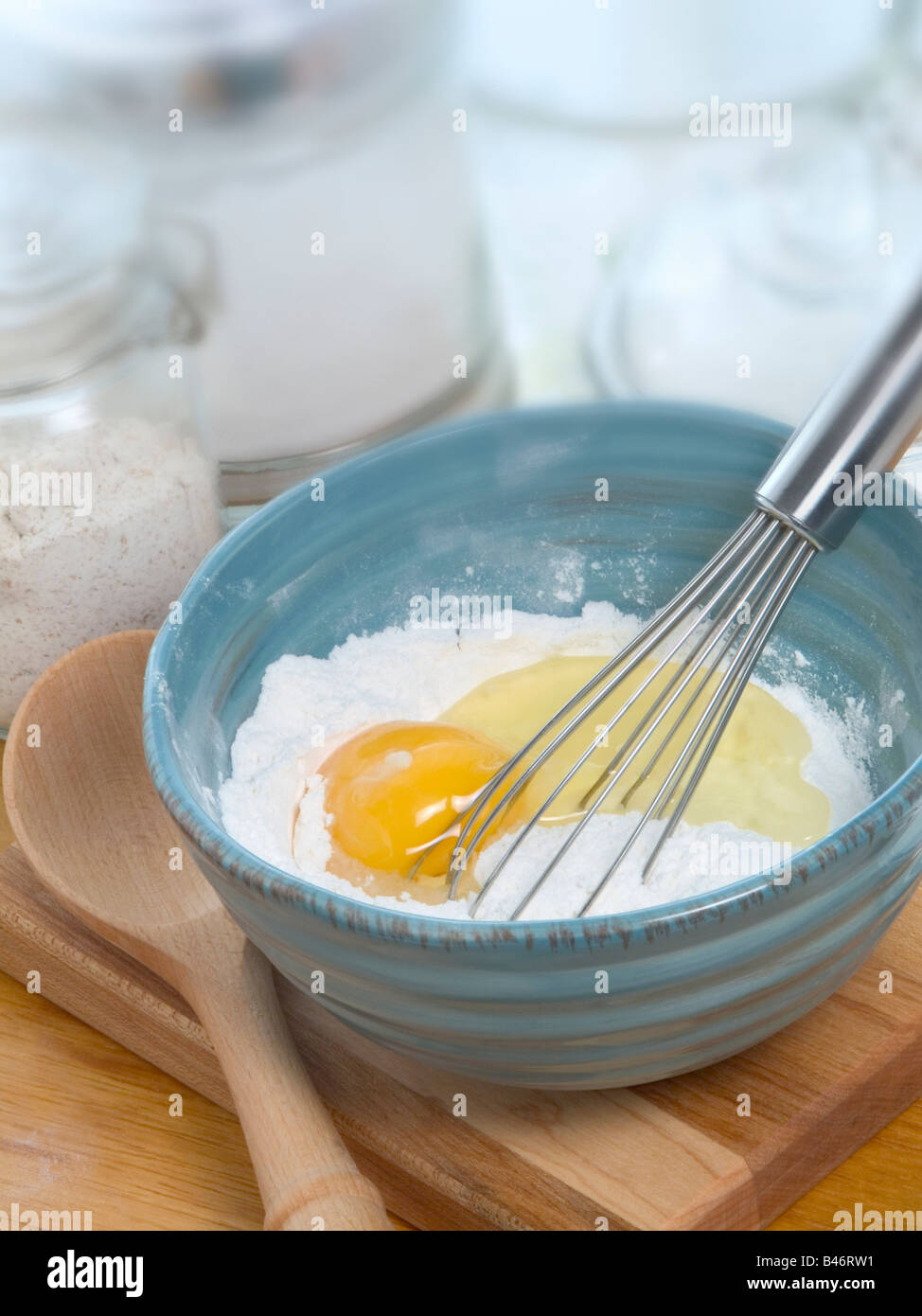 Flour and Egg in Mixing Bowl Stock Photo - Alamy