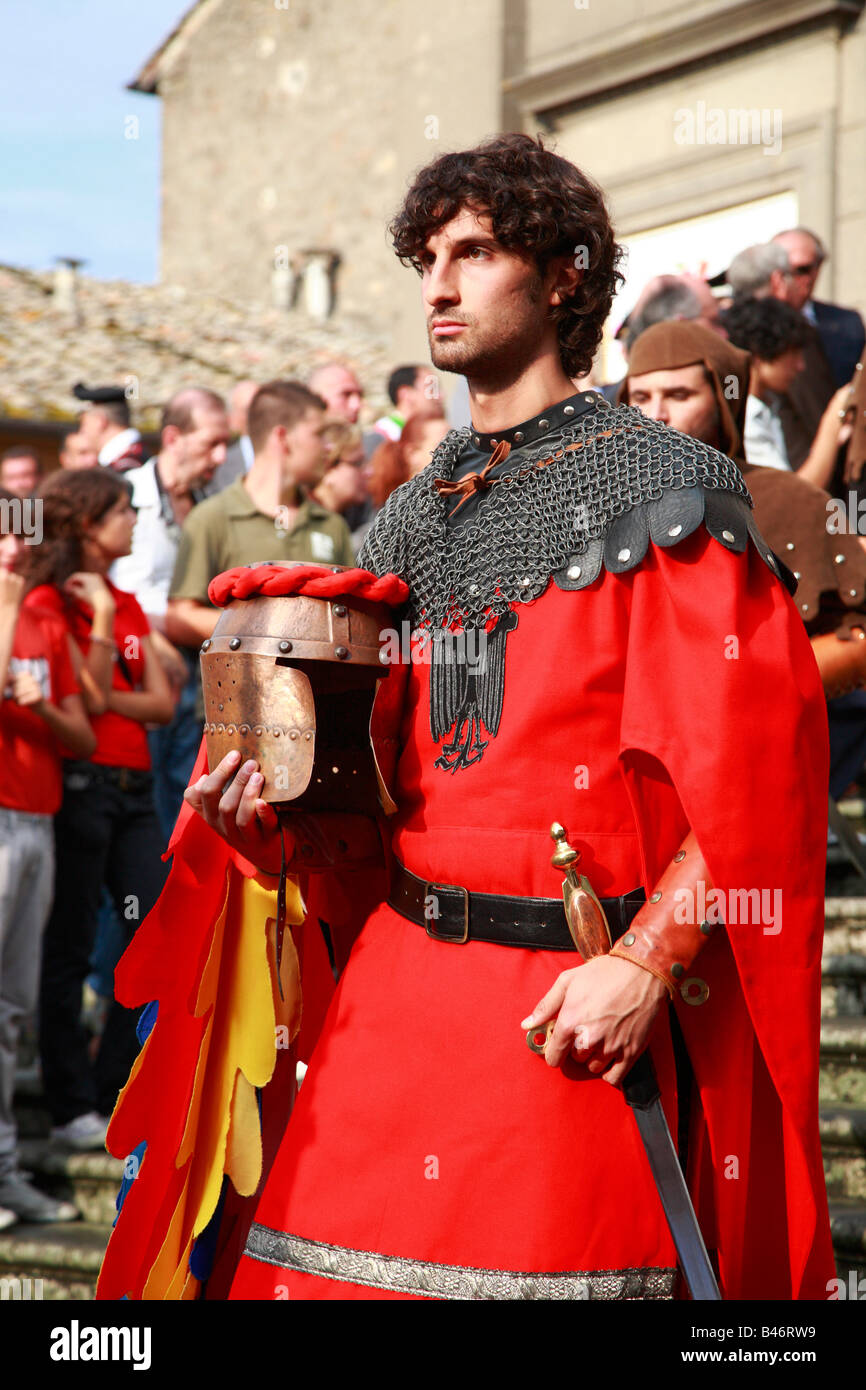 man in 14th century knights costume carrying helmet Stock Photo - Alamy