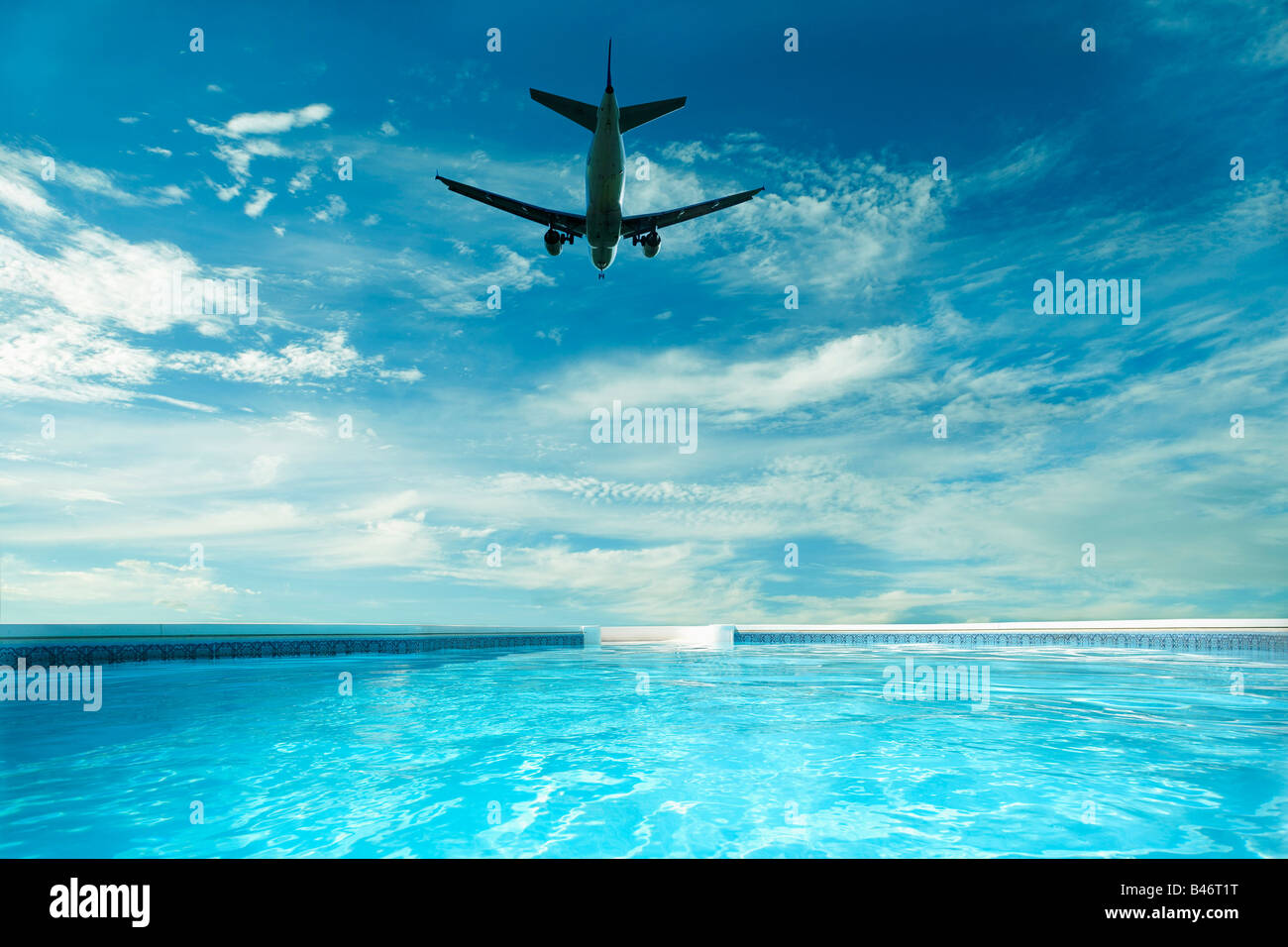 Plane Flying over Backyard Pool Stock Photo - Alamy