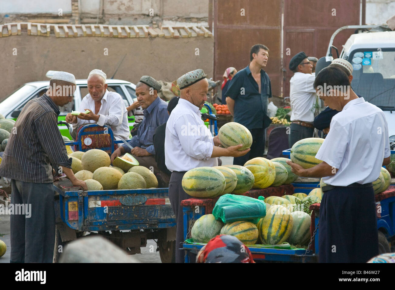 Uygur Men Buying and Selling Melons in Old Kashgar in Xinjiang Province ...
