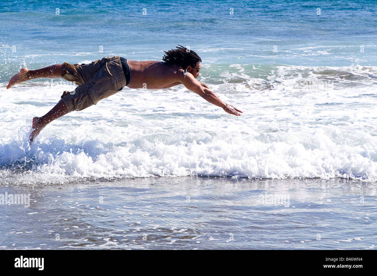 Jumping diving in water hi-res stock photography and images - Alamy