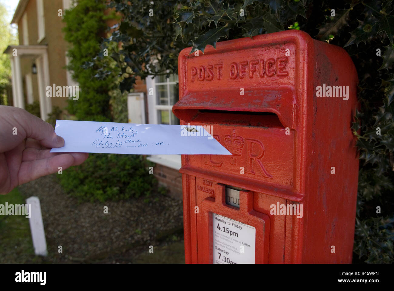 post letter Royal Mail monopoly postal service post box red Stock Photo ...